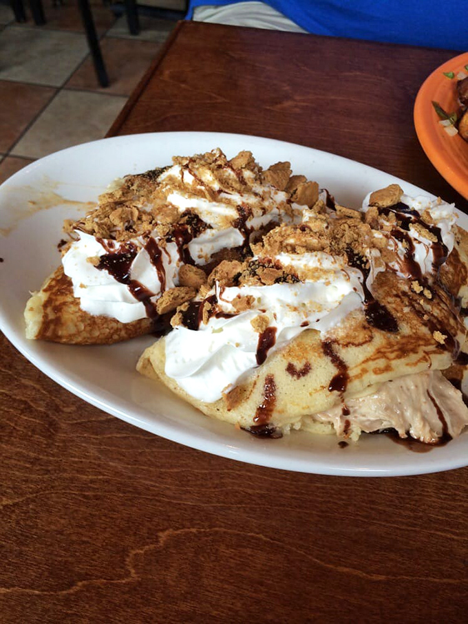 Not all heroes wear capes – some wear whipped cream, chocolate drizzle, and crumbled graham crackers atop fluffy pancakes.
