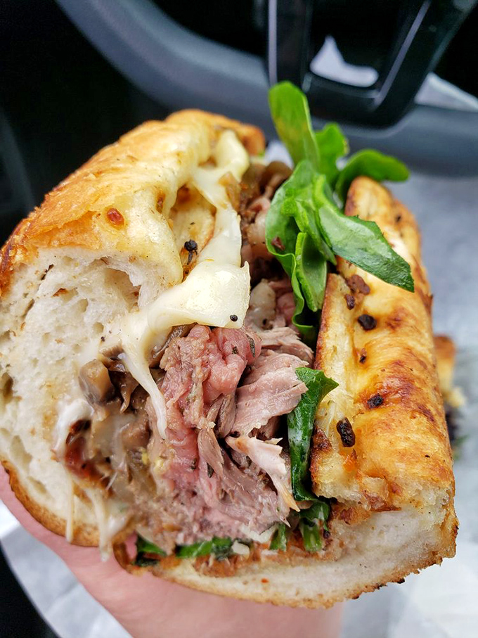 Melted cheese cascades over perfectly cooked meat—the sandwich equivalent of hitting the lottery and finding out you've got an extra ticket.