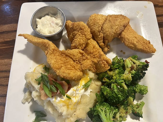 Southern fried catfish with all the fixings—proof that sometimes the best ocean treasures come served on solid ground.