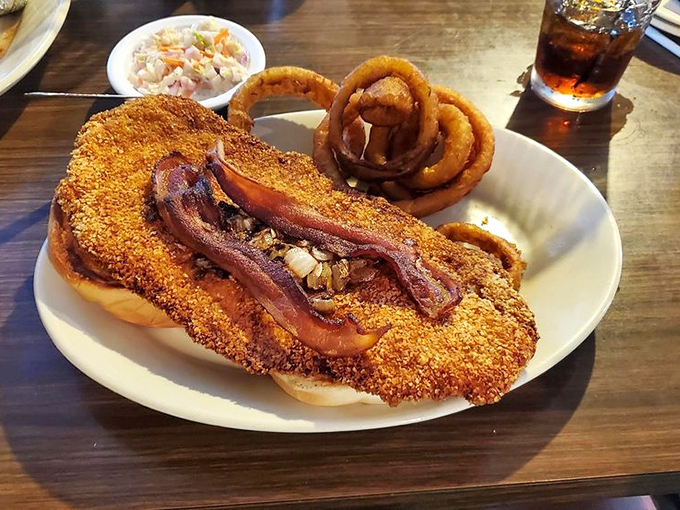 This cornmeal-crusted catfish topped with bacon strips isn't trying to be fashionable – it's too busy being delicious.