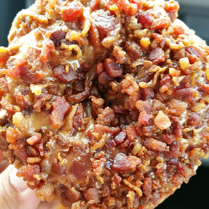 The Vermont Swine isn't just a donut – it's maple-glazed evidence that bacon makes everything better, even breakfast's sweetest ambassador.