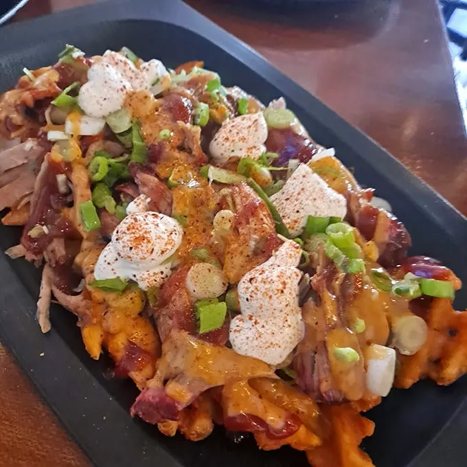Loaded waffle fries that could make a cardiologist weep—worth every delicious calorie and momentary guilt.