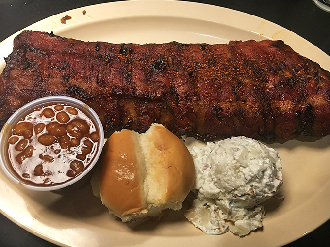 This isn't just a rack of ribs—it's a meat masterpiece with the kind of bark that makes tree trunks jealous.