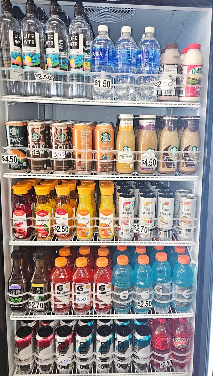 The beverage cooler: where fancy coffee drinks and humble Gatorade coexist in perfect harmony. Hydration options for every donut adventure.