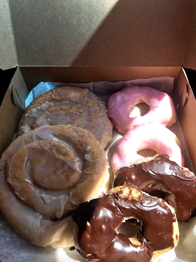 The holy quartet: glazed, chocolate, pink frosted, and cinnamon. Like the Beatles of breakfast, each one brings something special to the party.
