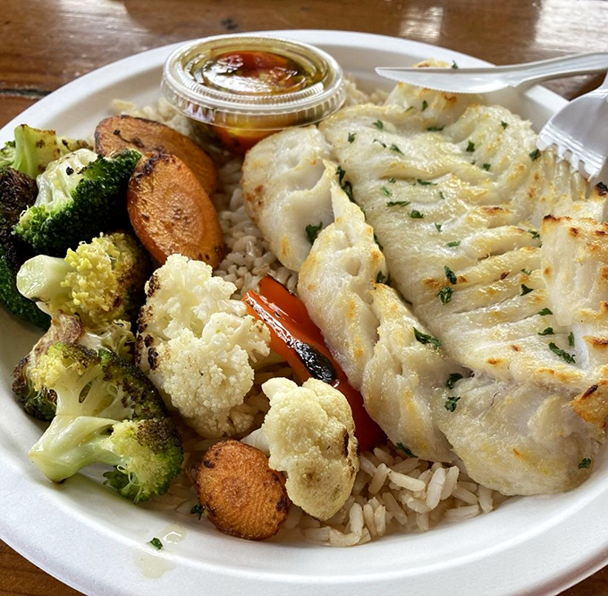 Simplicity on a plate: perfectly broiled cod with colorful vegetables. Sometimes the least complicated dishes require the most skill to execute flawlessly.