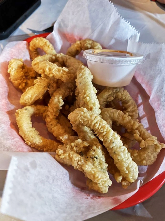 Golden-fried calamari that crackles with each bite—the seafood equivalent of potato chips, except you can't stop at just one basket.