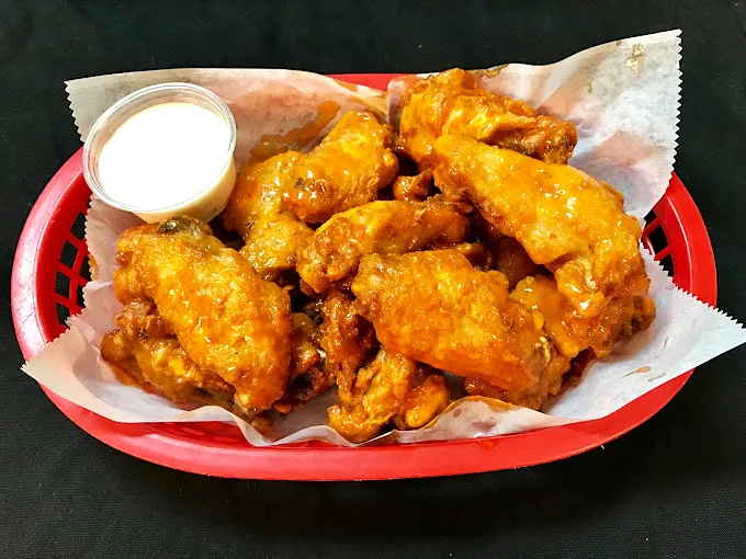 These wings aren't just golden—they're trophy-worthy, with sauce that demands you keep a stack of napkins at the ready.