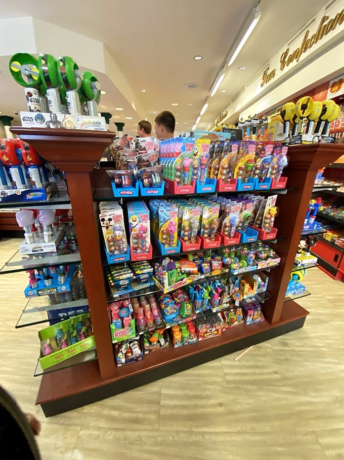 This isn't just a display—it's a shrine to childhood joy where POP figurines and nostalgic candy combine for maximum impulse-purchase power.