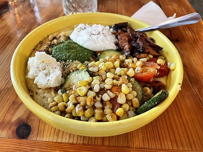 Sunshine in a bowl—roasted corn, fresh vegetables, and perfectly poached eggs create a breakfast symphony. This is how Monday mornings become bearable again.