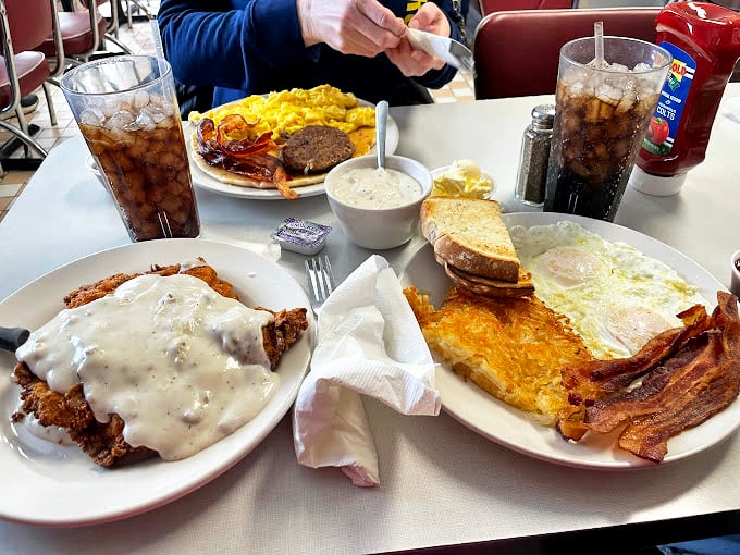 Breakfast platters that could feed a small army—where gravy-smothered country fried steak meets eggs and toast in a morning symphony that hits all the right notes.