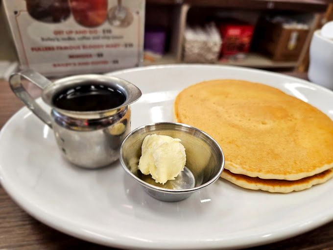 Pancakes that don't need Instagram filters—just maple syrup and butter in their simplest, most honest form.