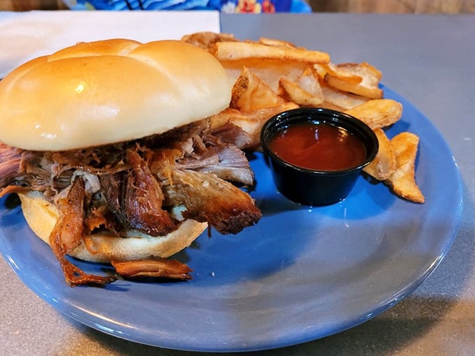 That pulled pork sandwich isn't messing around. Tender meat piled high on a soft bun with house-made chips—road trip fuel of champions.