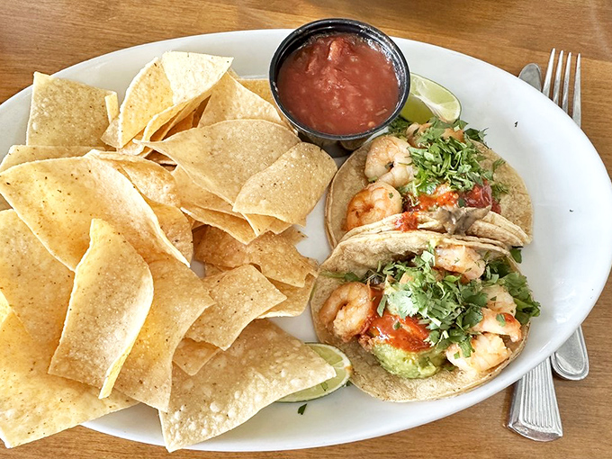 Shrimp tacos that deliver coastal vacation vibes with each bite—fresh cilantro, tender shrimp, and tortillas that clearly didn't come from a package.