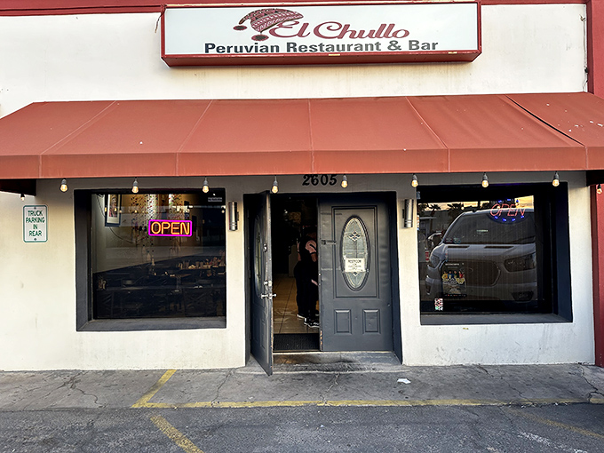 Behind this unassuming door lies a world where lime-kissed ceviche and arroz con mariscos reign supreme over desert dining.
