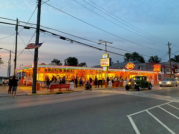 Eddie's Grill glows like a neon-lit time machine, serving up nostalgia alongside burgers that taste exactly like summer should.