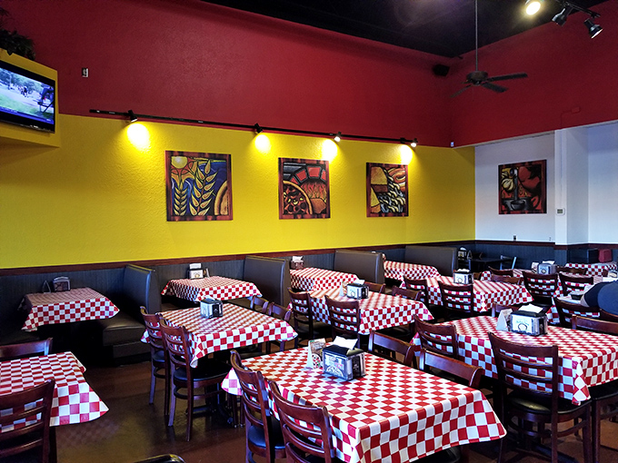 The vibrant interior with its checkered tablecloths feels like stepping into your Italian-American cousin's dining room – if your cousin made incredible pizza.
