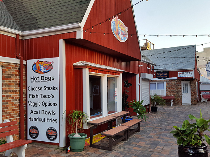 Red barn charm meets coastal casual at Twilley's. The menu board promises everything from classic dogs to açaí bowls.