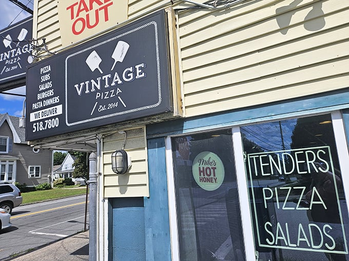 The "TAKE OUT" sign might be the most important road sign in Manchester—directing pizza pilgrims to Vintage's tender, perfect pies.