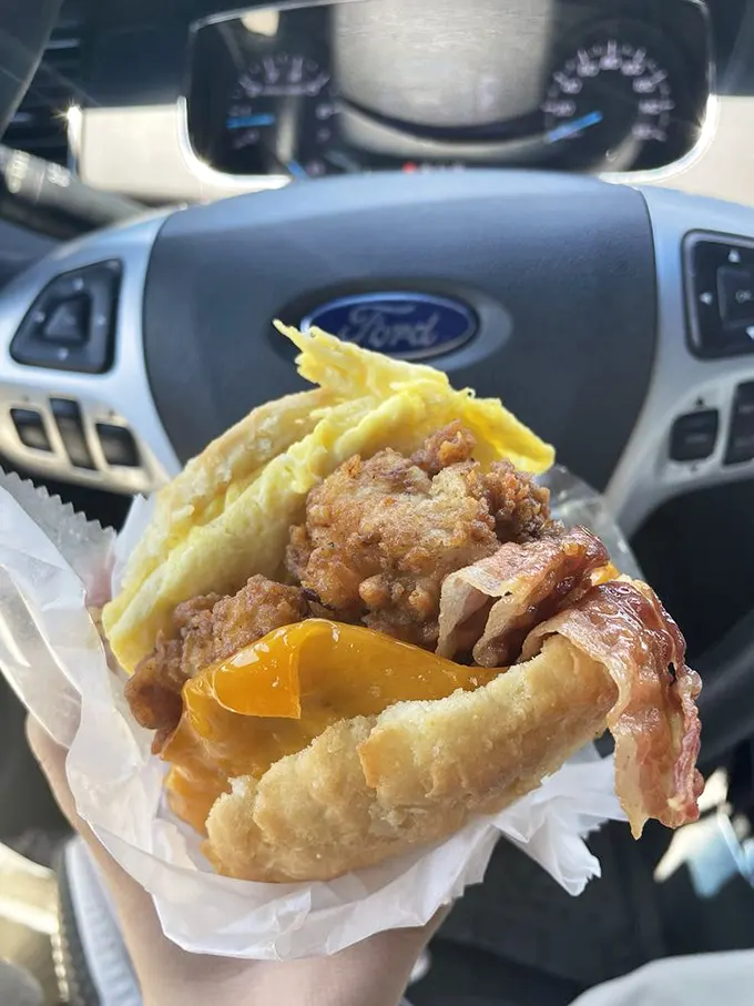 Car steering wheels—the unofficial dining tables of Sunrise devotees. This biscuit bomb of egg, cheese, and bacon demands both hands!