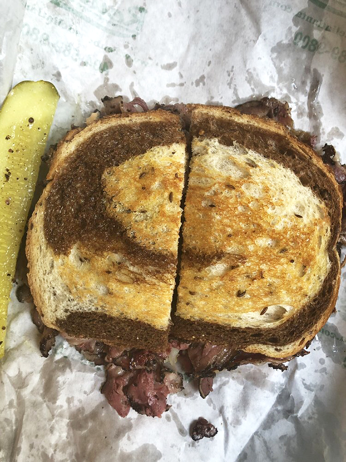 Every bite of this Reuben promises a perfect balance of flavors. The bread's toasty exterior gives way to the warm, savory filling within.
