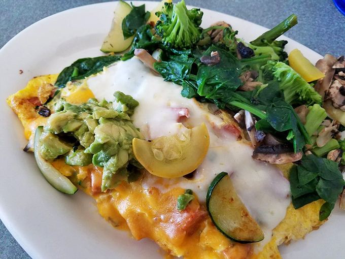 Mother Nature's garden party wrapped in eggs. The avocado isn't just a topping—it's making a statement about California living.