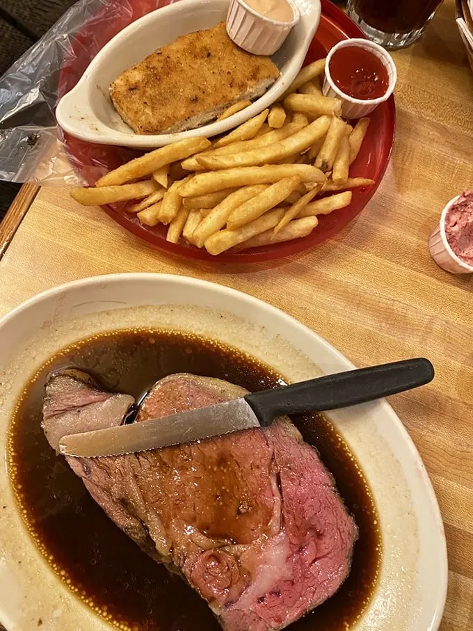 The knife slicing through this prime rib meets less resistance than a politician accepting a campaign donation. Pure beefy bliss.