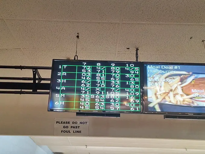 The digital scoreboard tells tales of triumph and gutter balls alike—where numbers don't lie but sometimes offer comic relief.