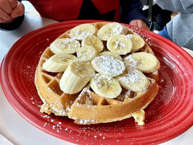 Bananas on waffles: nature's way of telling you it's okay to have dessert for breakfast. Powdered sugar snowfall included.