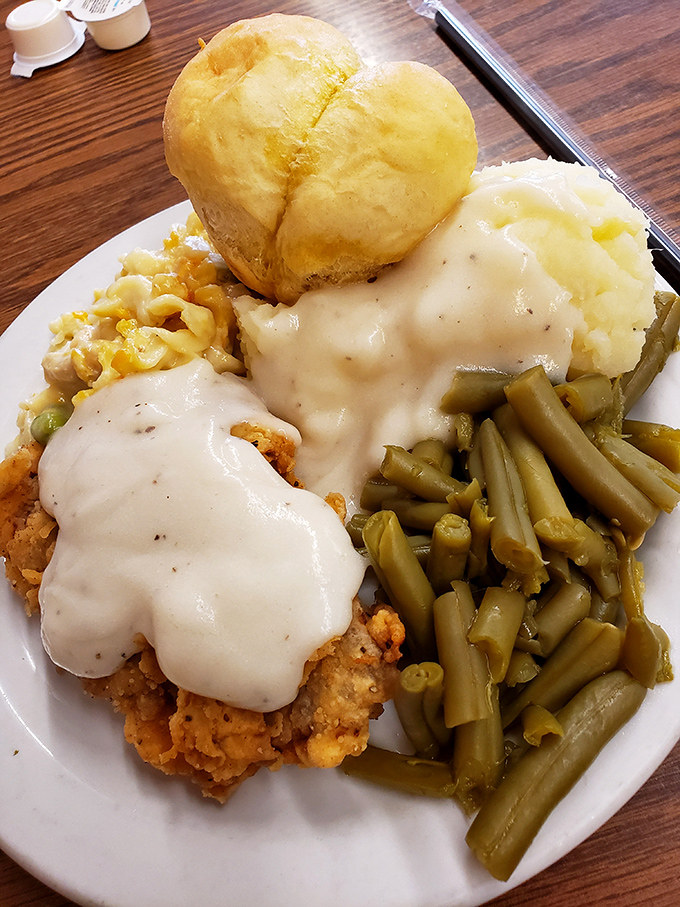 Chicken fried steak that could make a vegetarian question their life choices. That gravy blanket isn't just comfort food—it's a full comfort system.