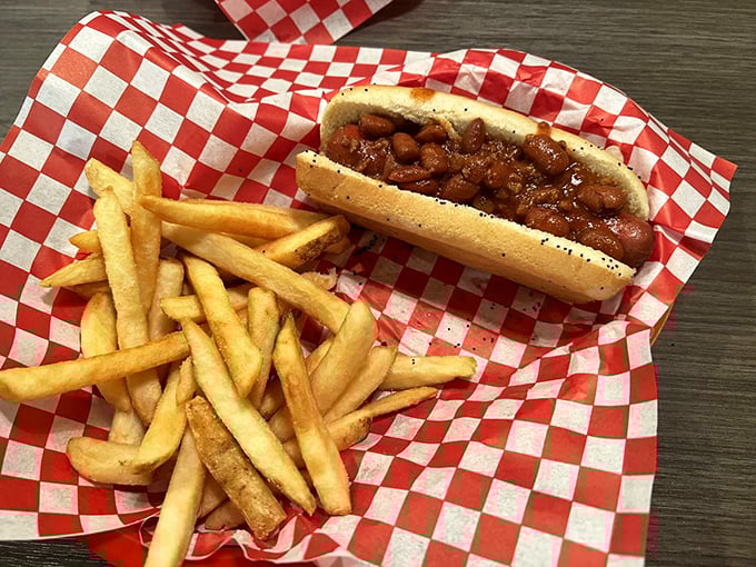 The humble chili dog with a side of golden fries—comfort food that speaks a universal language of satisfaction.