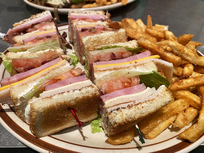 The club sandwich—architecture you can eat. Those perfectly stacked layers deserve their own blueprint and building permit.