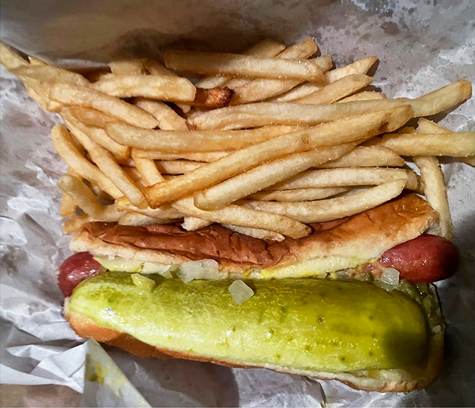 Chicago's holy trinity: a hot dog nestled alongside golden fries, a combo that's converted more food snobs than any fancy tasting menu.
