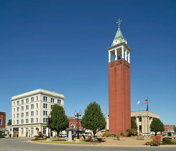 The clock tower and historic buildings frame Tower Square Plaza, where "meeting at the tower" has been Marion's social GPS for generations.