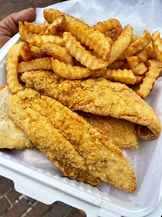 Crispy, golden whiting nestled alongside crinkle-cut fries – a combination so perfect it should have its own national holiday.