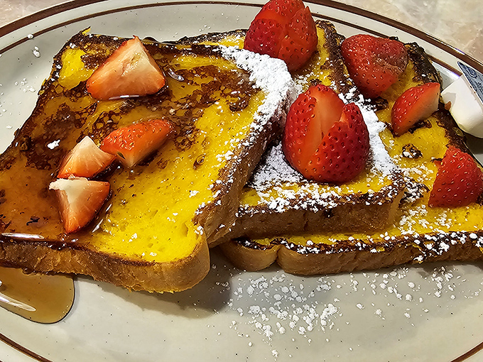 French toast that manages to be both custardy inside and perfectly caramelized outside—the strawberries are just showing off at this point.