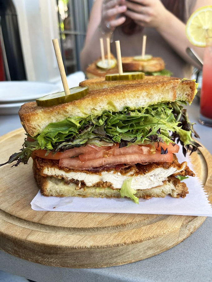 This isn't just a sandwich—it's a carefully engineered flavor delivery system where crispy chicken meets garden-fresh veggies on perfectly toasted bread.