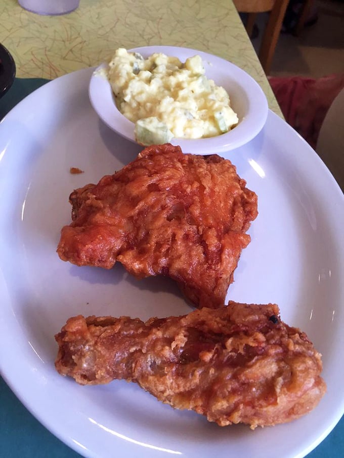 Fried chicken that doesn't need a trendy Nashville hot makeover – just honest seasoning and a crust that announces itself with every bite.