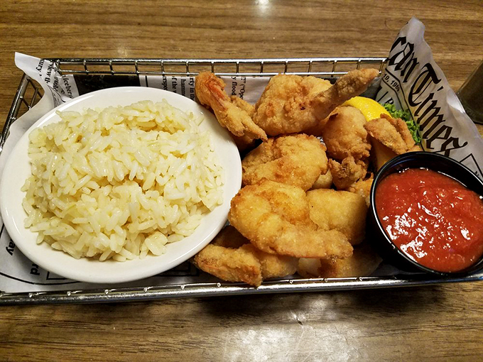 This basket of golden-fried shrimp nested on a bed of crispy fries isn't just dinner—it's therapy wrapped in newspaper with a side of tartar sauce.