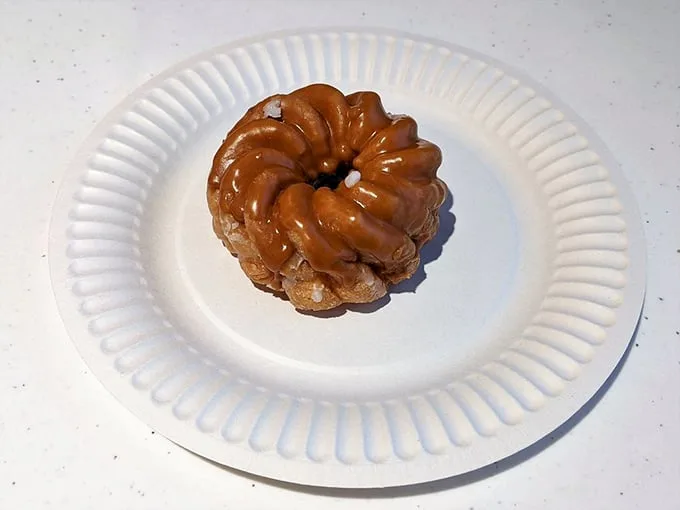 The glazed cruller—a delicate spiral of pastry perfection that somehow manages to be both substantial and ethereal.