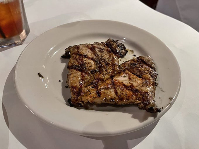 This perfectly grilled chicken breast laughs at diet food stereotypes—bathed in a cream sauce that would make Julia Child high-five a Southern chef.