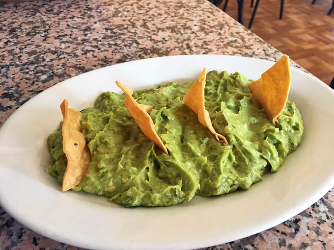 Guacamole that looks like it was whipped up moments ago—because it probably was. Those tortilla chips are just delivery vehicles for green gold.