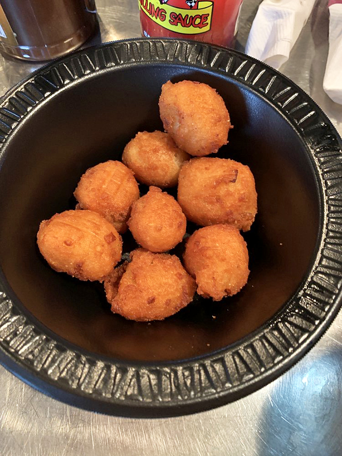 Golden hushpuppies that don't just ask for silence—they command it. One bite and conversation stops as everyone pays proper respect.