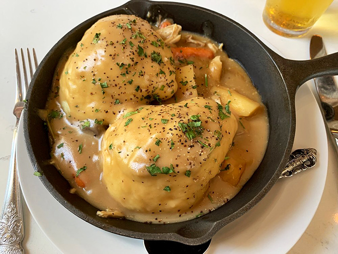 Chicken and dumplings that would make your grandmother both jealous and proud – comfort in a cast iron skillet that warms you from the inside out.