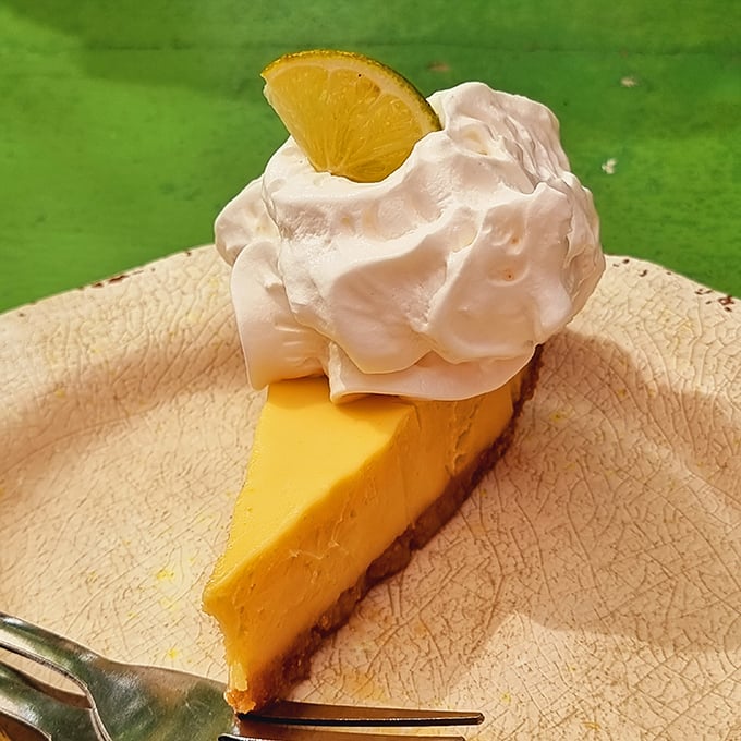 The Key Lime Pie here doesn't mess around – vibrant yellow filling, just the right balance of sweet and tart, topped with a cloud of whipped cream.