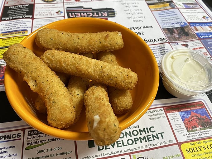 Not just mozzarella sticks—they're crunchy golden happiness tubes waiting to unleash their melty cheese magic on your unsuspecting taste buds.