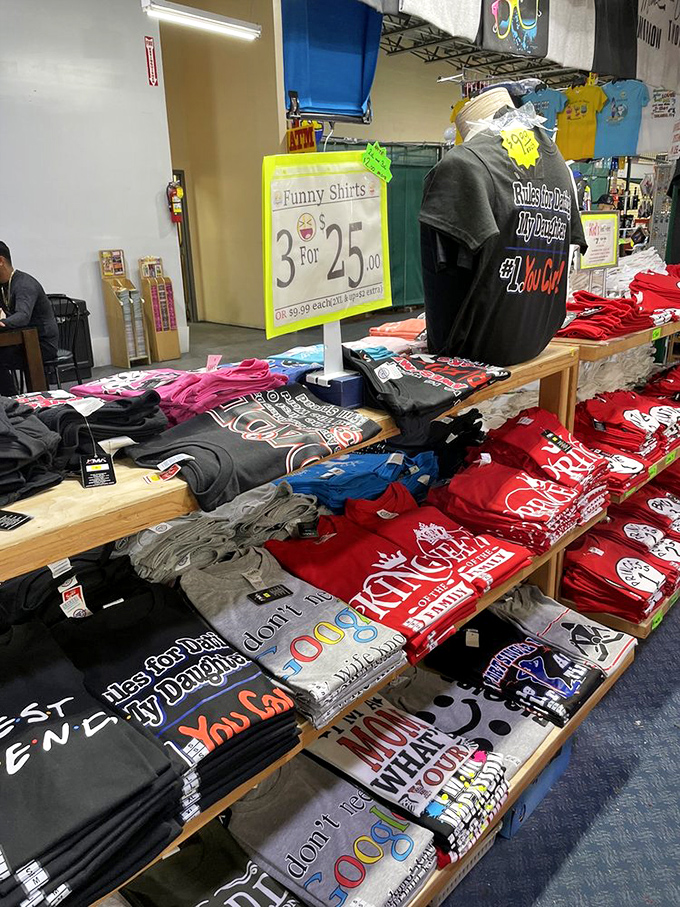 The "3 for $25" funny t-shirt display—where dad jokes achieve immortality through cotton and clever typography.