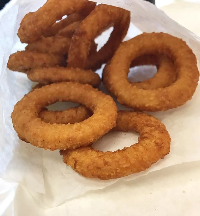 These onion rings aren't just side dishes—they're golden halos of crispy perfection. Crunchy on the outside, sweet within.