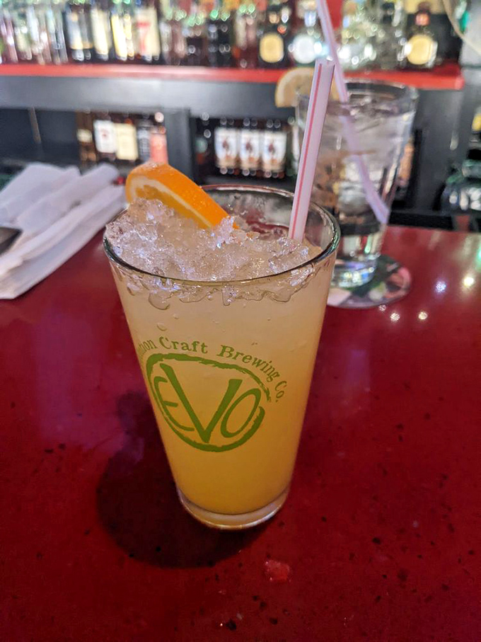 That orange crush isn't just a drink—it's summer in a glass. Maryland's unofficial cocktail looks right at home on Jennings' classic red bar top.