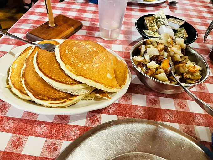 The holy trinity of breakfast: golden pancakes, fluffy eggs, and potatoes fried to perfection. This isn't a meal—it's morning poetry on a plate.